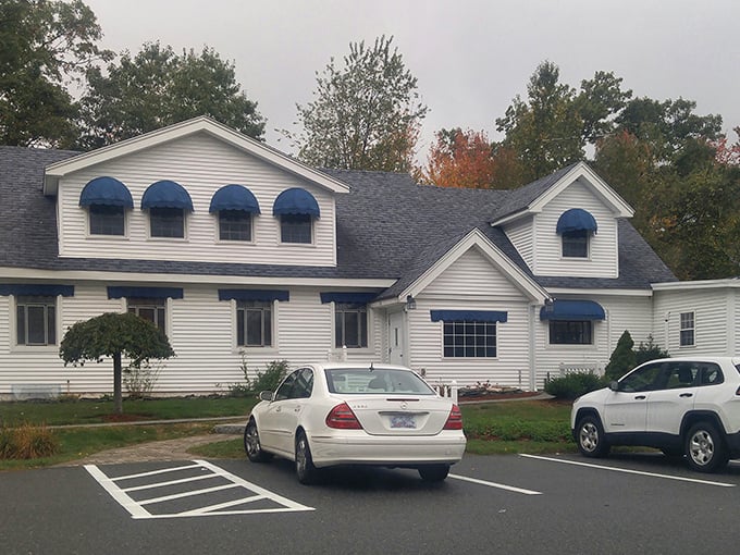 Classic New England architecture with those distinctive blue awnings. This charming establishment offers the kind of comfort you can't put a price tag on.