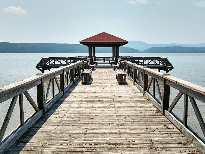 Lake Dardanelle's wooden pier stretches toward mountain views that would cost you triple in Colorado but come complimentary with Russellville's zip code.