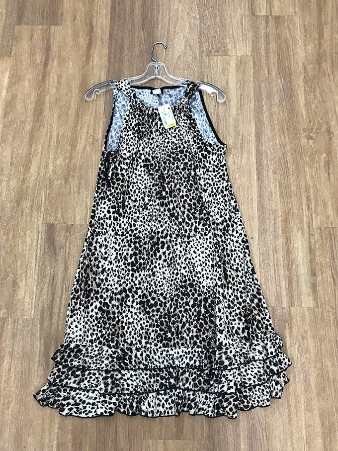 Yesterday's fashion becomes tomorrow's statement piece. This leopard print dress hangs patiently, ready to roar back into someone's wardrobe rotation.