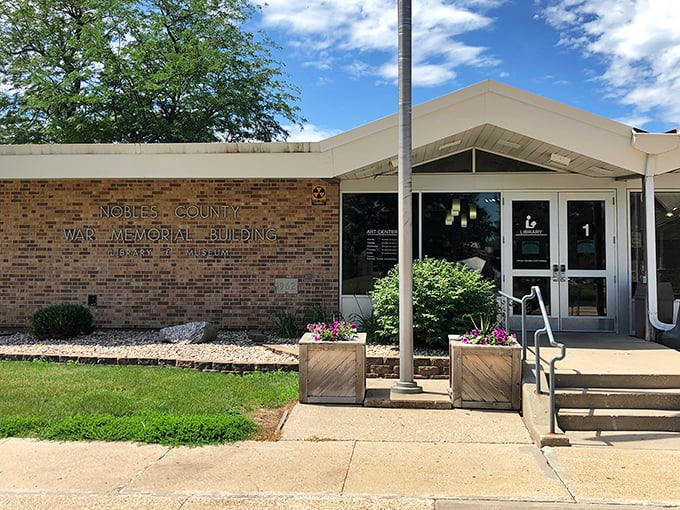 The Nobles County War Memorial Building stands as a testament to both history and accessibility&mdash;note those welcoming flower planters flanking the entrance.