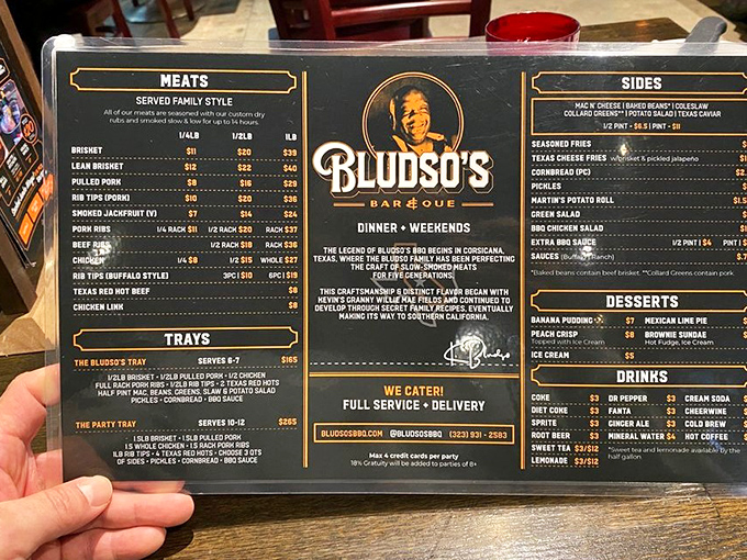The menu at Bludso's reads like barbecue poetry—each item a verse in an epic meat sonnet that makes vegetarians question their life choices.