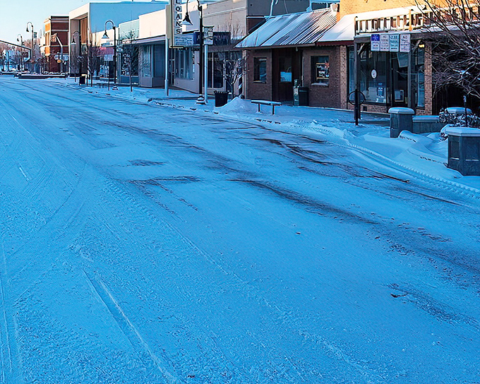 Winter blankets Main Street in blue-tinted silence, when small-town Colorado shows its toughest and most beautiful face simultaneously.
