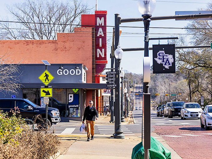 The SFA banner flies proudly on North Street, where college-town energy meets small-town hospitality in perfect East Texas harmony.