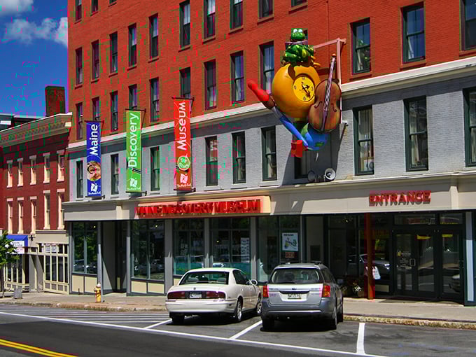 The Maine Discovery Museum's whimsical frog mascot welcomes curious minds of all ages to downtown's interactive learning playground.