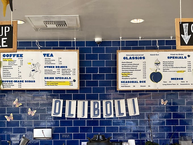 The menu board reveals Oliboli's true colors – naturally leavened classics, hand-cut specials, and house-made sodas that laugh in the face of ordinary.