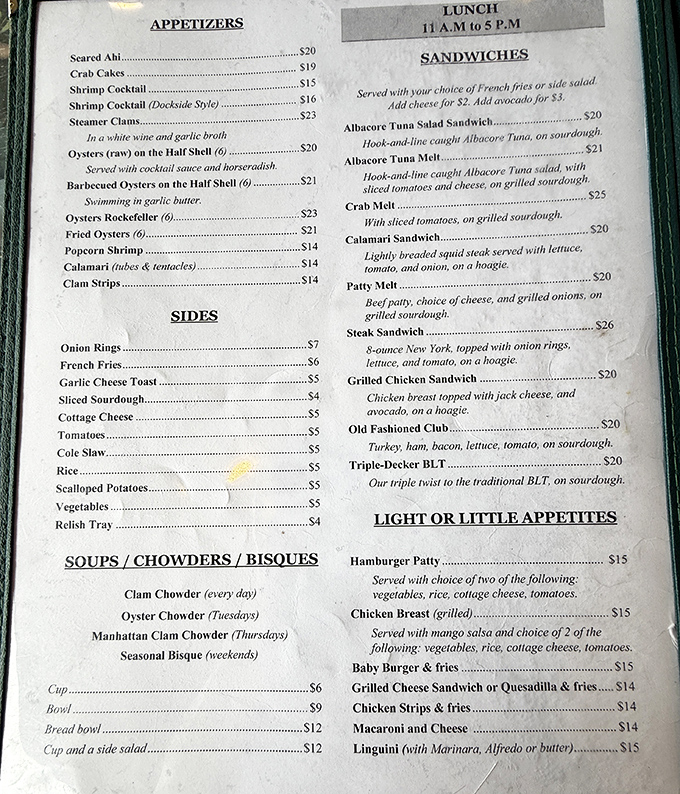 A menu that reads like love letters from the sea. Each item promises a different oceanic romance, from oyster flirtations to full-blown affairs with crab melts.