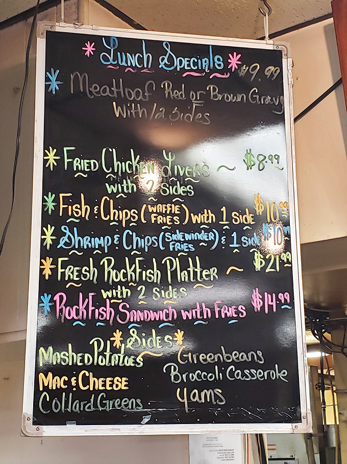 The hand-written chalkboard menu tells you everything you need to know—this place prioritizes fresh rockfish and comfort food classics over fancy descriptions.