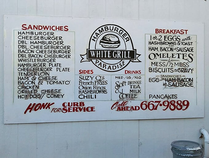 "Hamburger Paradise" isn't just a slogan&mdash;it's a promise written right on the wall. And that "Honk for Curb Service" option? Pure Americana.