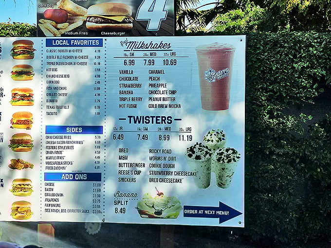 The menu board promises everything from towering burgers to twisted treats – it's like a greatest hits album of American dining.