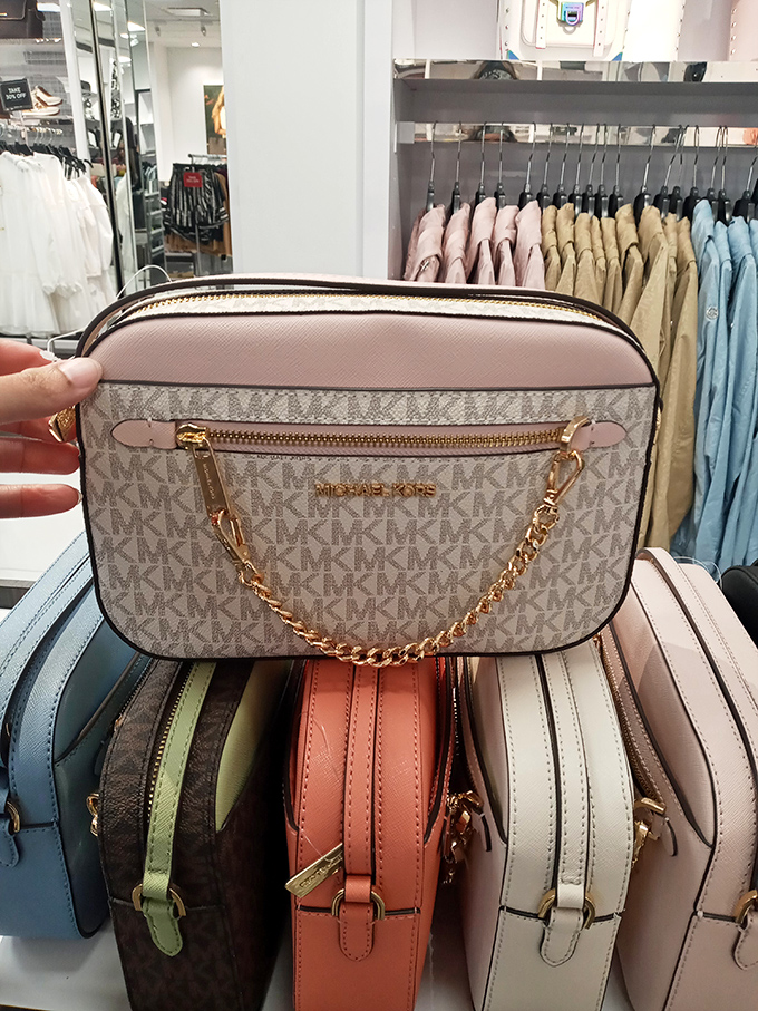 Designer dreams within reach! Michael Kors bags in every hue stand ready for their forever homes, no second mortgage required.