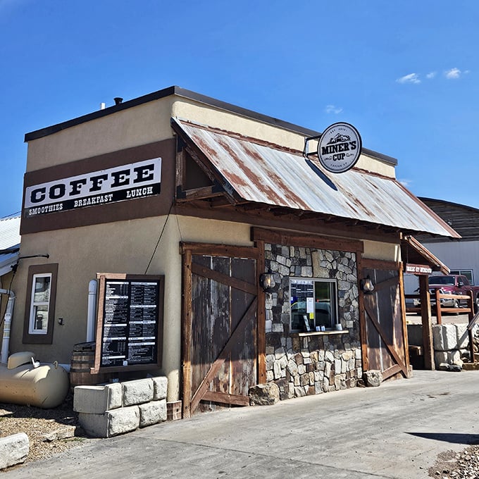 That weathered corrugated metal and stone facade at Miner's Cup signals serious coffee ahead&mdash;rustic charm with caffeinated purpose behind barn doors. 