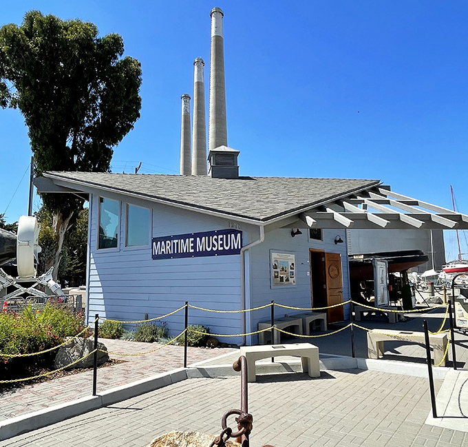 The Maritime Museum stands beneath the town's distinctive power plant stacks, preserving the fishing heritage that built this charming coastal community.