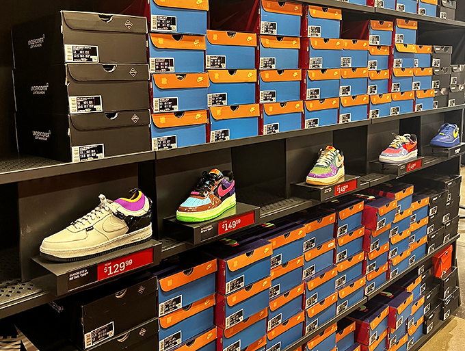 Colorful sneakers lined up like soldiers ready for duty, each price tag a battle cry for your wallet.