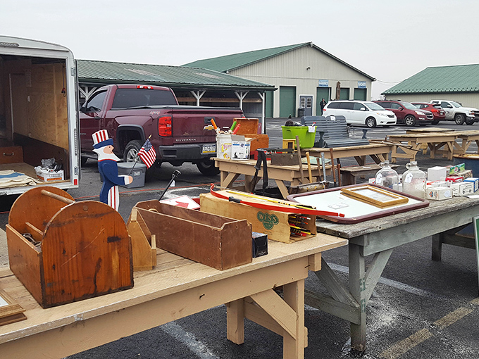A patriotic Uncle Sam figure stands guard over wooden toolboxes and benches—Americana in its most authentic, slightly weathered form.