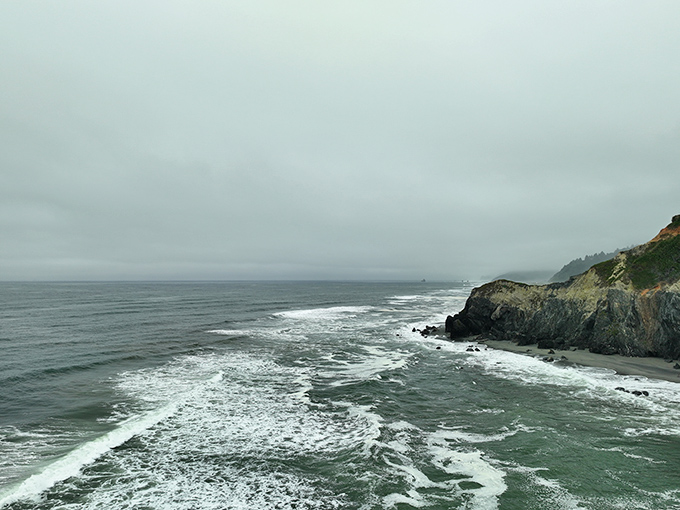 The Pacific puts on its daily drama show. These rugged cliffs have witnessed countless ocean performances, each wave telling a different story.
