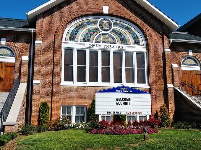 The Owen Theatre stands as Mars Hill's cultural cornerstone, where the stained glass window has witnessed more drama than a season of "The Crown."
