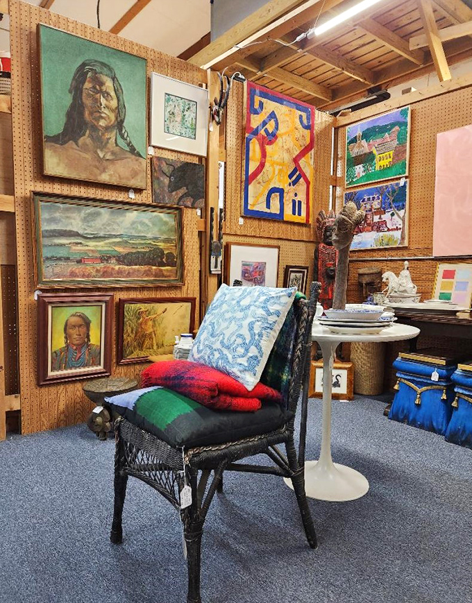 Art from every era adorns the walls, from striking portraits to abstract splashes of color. That wicker chair is practically begging for a new home. 