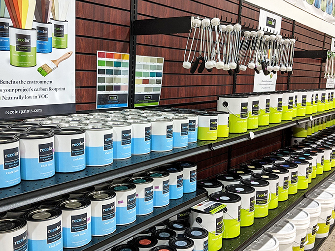 The paint section: where DIY dreams begin and "oops" colors become happy accidents for budget-conscious home renovators.