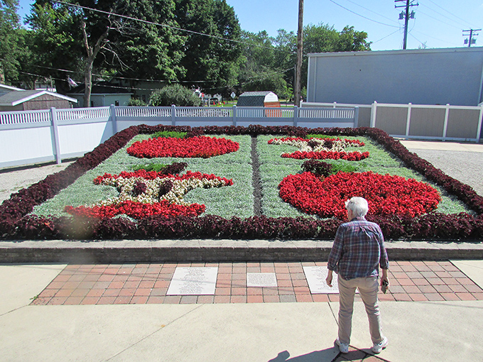 Living art in full bloom. The meticulously maintained Quilt Garden transforms traditional Amish quilt patterns into a vibrant floral display that changes with the seasons.