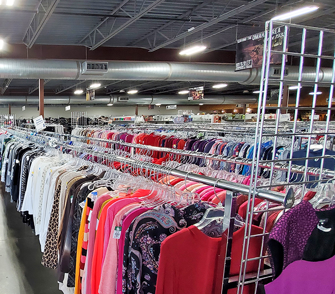The rainbow of garments stretches like a textile horizon &ndash; each hanger potentially holding your next favorite outfit.