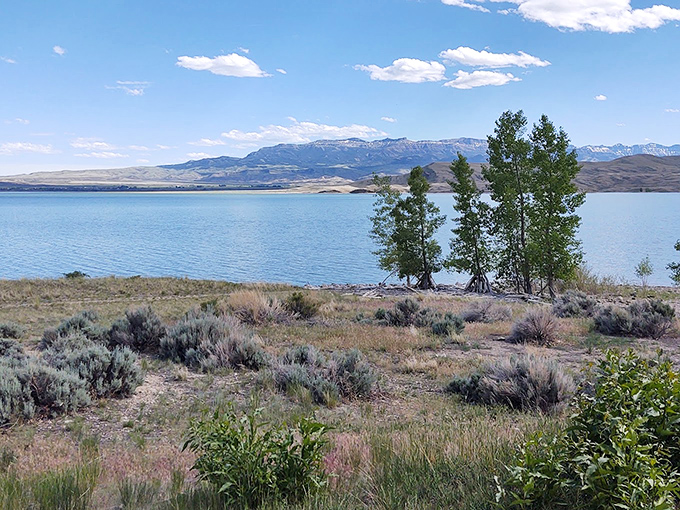 Mother Nature's infinity pool doesn't need chlorine. The reservoir's crystal waters mirror mountains that have witnessed centuries of Wyoming stories.