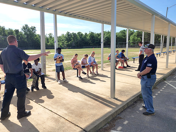 Community gatherings under simple pavilions—where important town business gets discussed alongside last Friday's high school football game.