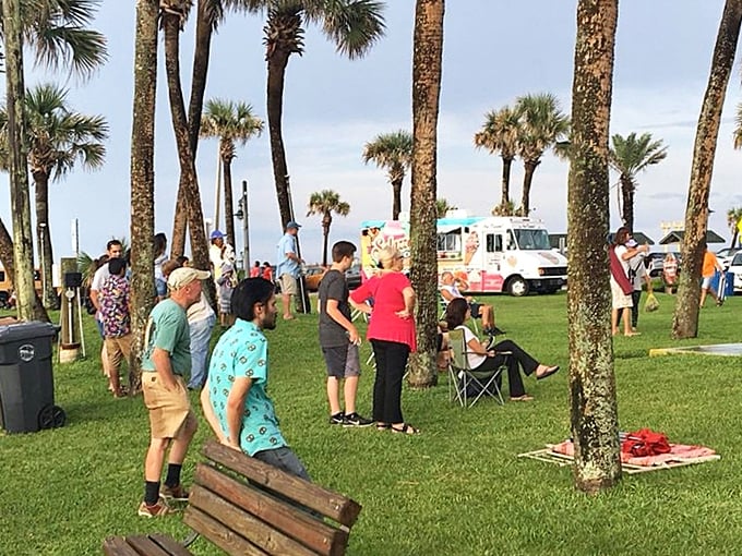 Under the swaying palms, locals and visitors gather for community events where conversations flow as easily as the ocean breeze.