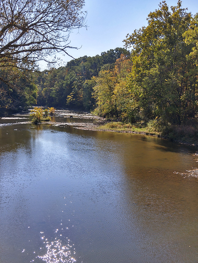 The Grand River flows beneath with quiet confidence, carrying stories downstream while reflecting skies that have witnessed centuries of Ohio's evolving landscape.