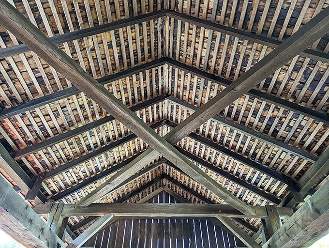Look up! The intricate wooden lattice overhead isn't just structural genius&mdash;it's architectural poetry that's been sheltering travelers for over a century.