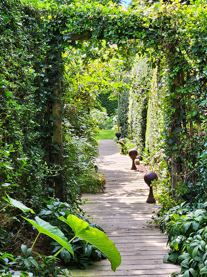 Nature reclaims architecture in this verdant pathway at Sakonnet Garden, creating a secret passage that would make Frances Hodgson Burnett swoon.