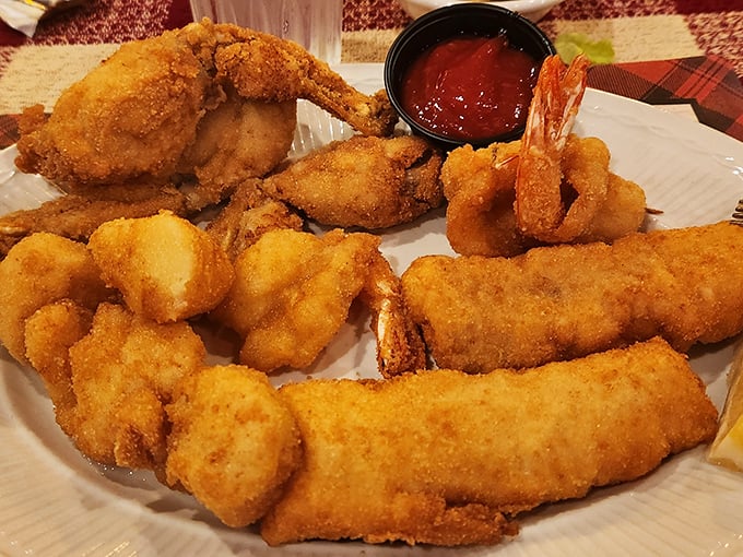 Golden-fried perfection on a plate. This seafood platter isn't trying to impress food critics&mdash;it's trying to make you happy. Mission accomplished.