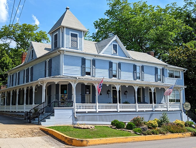 The Shepard Inn stands like a Victorian time capsule, complete with wraparound porch perfect for afternoon contemplation.