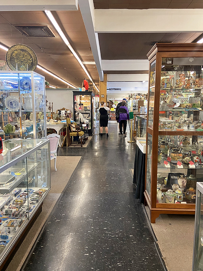 Treasure hunters on the prowl, scanning display cases with the focus of archaeologists. The thrill of the find keeps everyone moving forward.