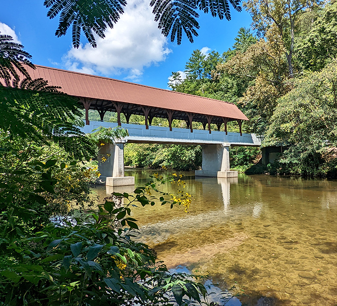 Beneath the bridge's geometric ceiling, sunlight creates ever-changing patterns on the walkway—nature's own light show without the admission fee.