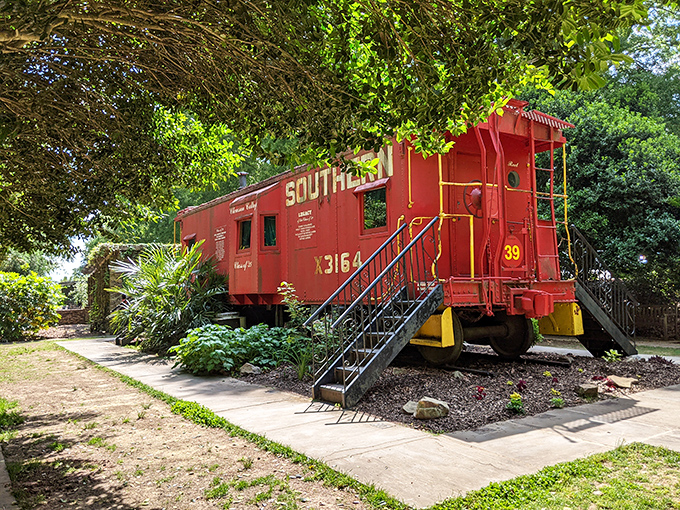 All aboard the nostalgia express! This vibrant Southern Railway caboose proves even trains can enjoy retirement in style.