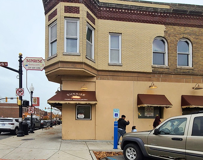 Sunrise Restaurant sits on the corner like a beacon of breakfast hope, promising skillets that could cure any ailment known to mankind.