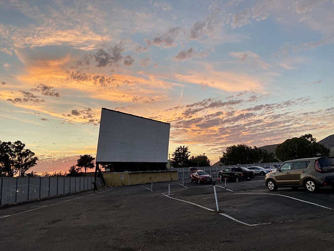 Nature provides the perfect pre-show entertainment as California's golden hour paints the sky above Sunset Drive-In's massive screen.
