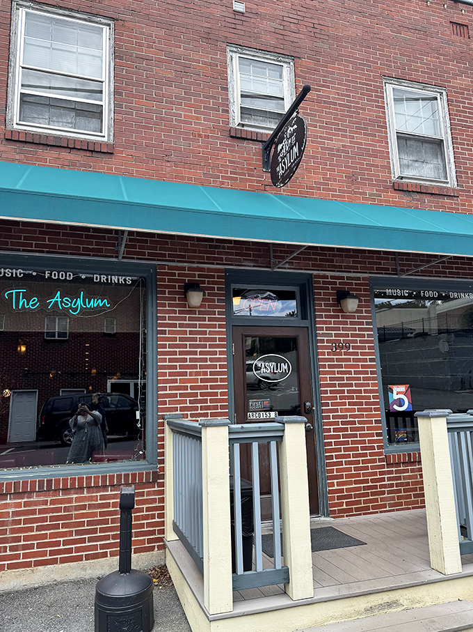 The Asylum isn't what you think—unless you thought "charming brick venue for craft cocktails and live music." Plot twist!