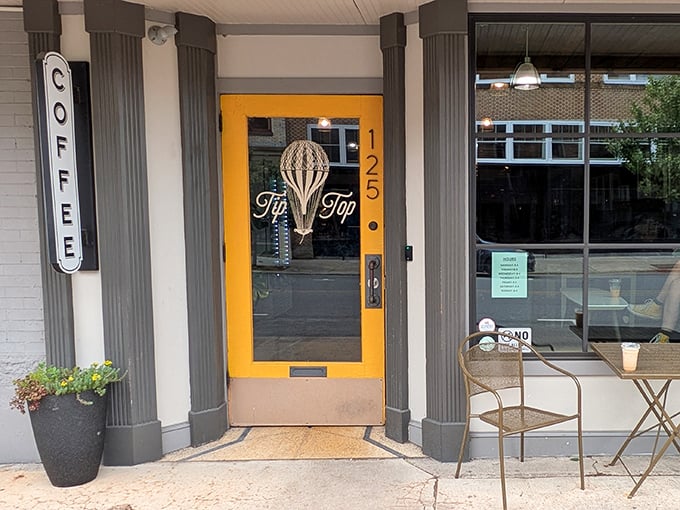 That cheerful yellow door at TipTop isn't just inviting &ndash; it's practically demanding you come in for coffee.