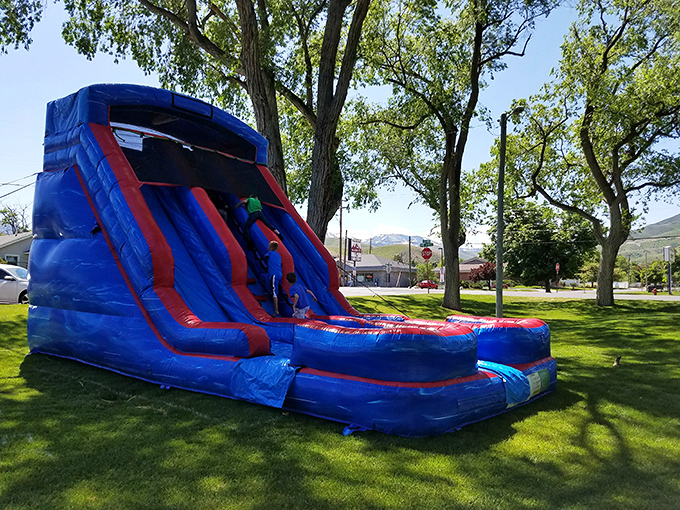 Nothing says "summer in small-town America" quite like an inflatable water slide bringing joy to kids while parents enjoy blessed moments of peace.