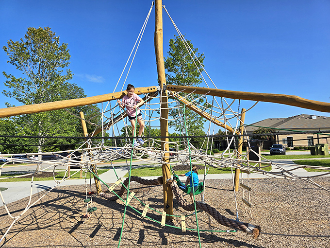 Kids conquering this playground structure with the determination of American Ninja Warriors&mdash;parental coffee break officially justified.