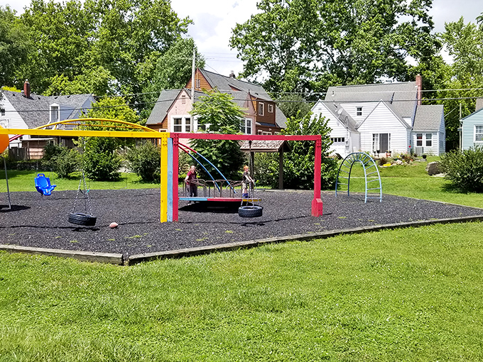 Tuhey Park's colorful playground equipment stands ready for childhood adventures. Remember when our biggest worry was who got the swing first?