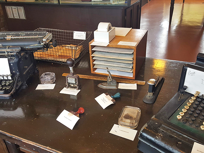A perfectly preserved station agent's desk, complete with vintage typewriters and office equipment. Each item tells a story of communication before we could simply text "running late."