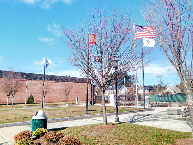 Veterans' Park provides a peaceful spot to honor those who served, with flags waving proudly against Massachusetts' famously blue skies.