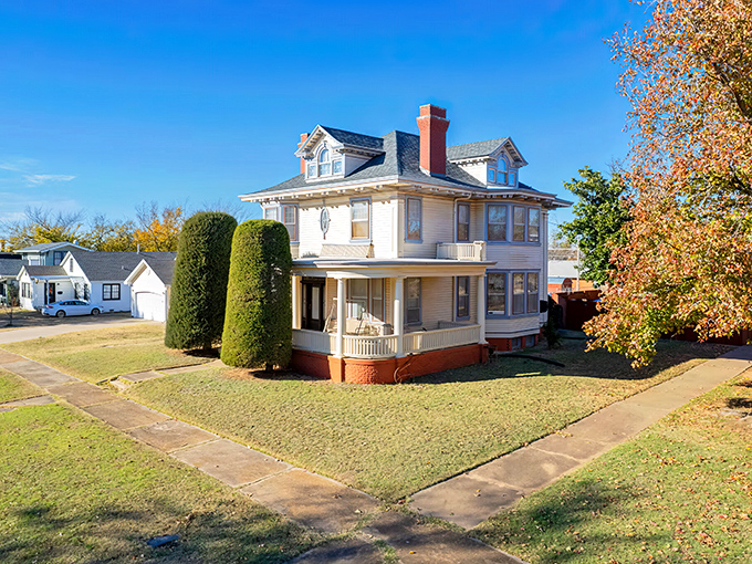 This classic American foursquare home with its welcoming porch practically whispers, "Retirement doesn't have to mean downsizing your charm quota."