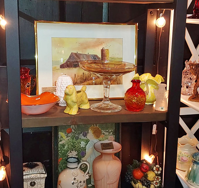 Every shelf tells a story here. From delicate glassware to rustic farm paintings, these vignettes aren't just displays&mdash;they're windows into Vermont's past.