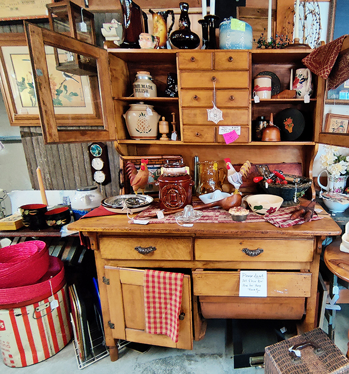 This vintage kitchen hutch isn't just furniture; it's a time capsule where grandma's chicken soup recipe and Sunday dinners still linger in the wood grain.