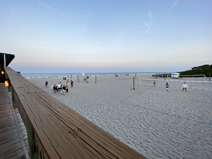 As twilight settles over Cocoa Beach, volleyball nets stand ready for impromptu matches. The cool evening sand becomes a community gathering place for sunset games.