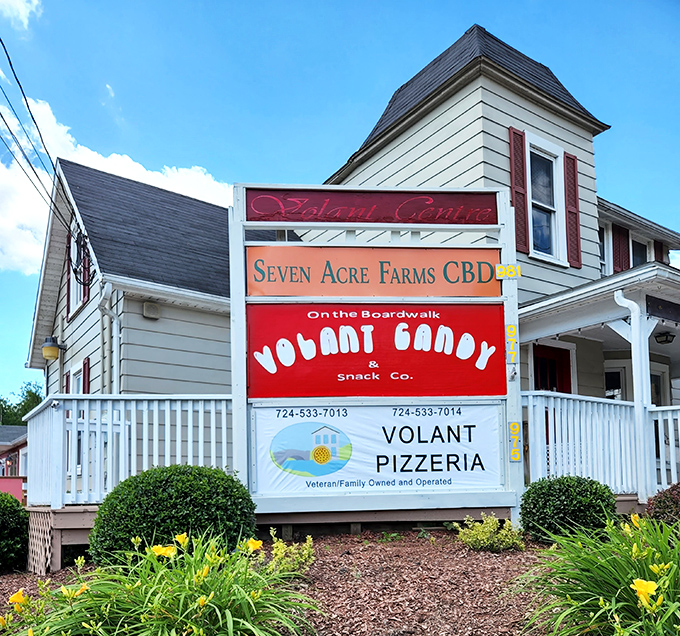 The Volant Boardwalk sign&mdash;a roadmap to happiness. Nothing says "small-town charm" quite like a candy shop and pizzeria sharing billing rights.