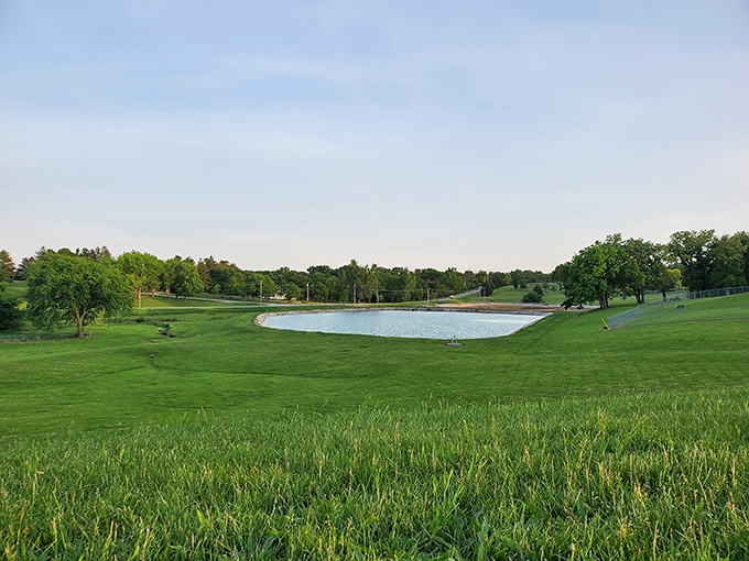 Nature's perfect mirror at Waterworks Park &ndash; where the still waters reflect Iowa's endless blue skies and locals find serenity just minutes from downtown.